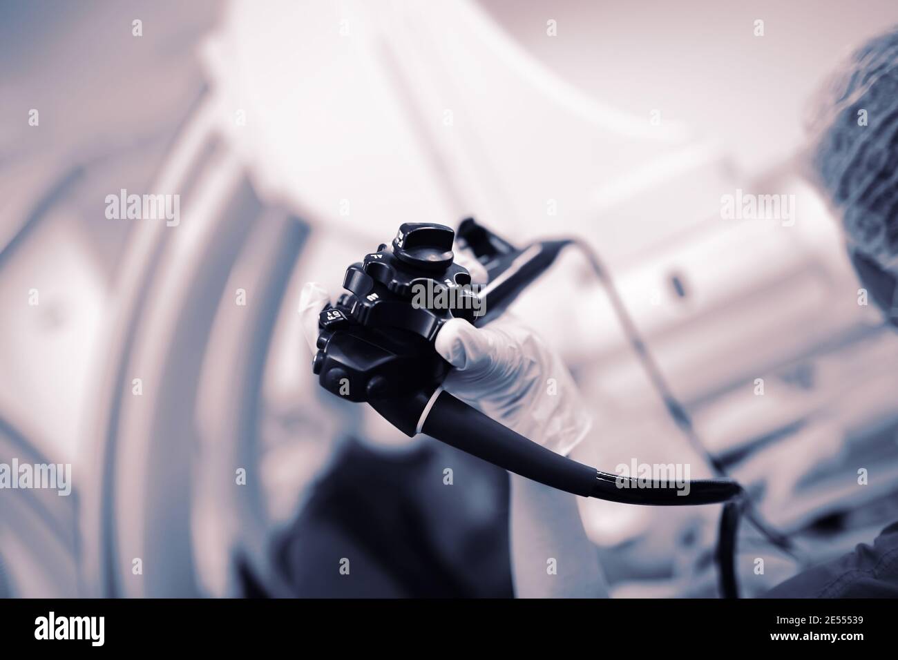 Endoscopy probe in the doctor's hand during procedure Stock Photo - Alamy