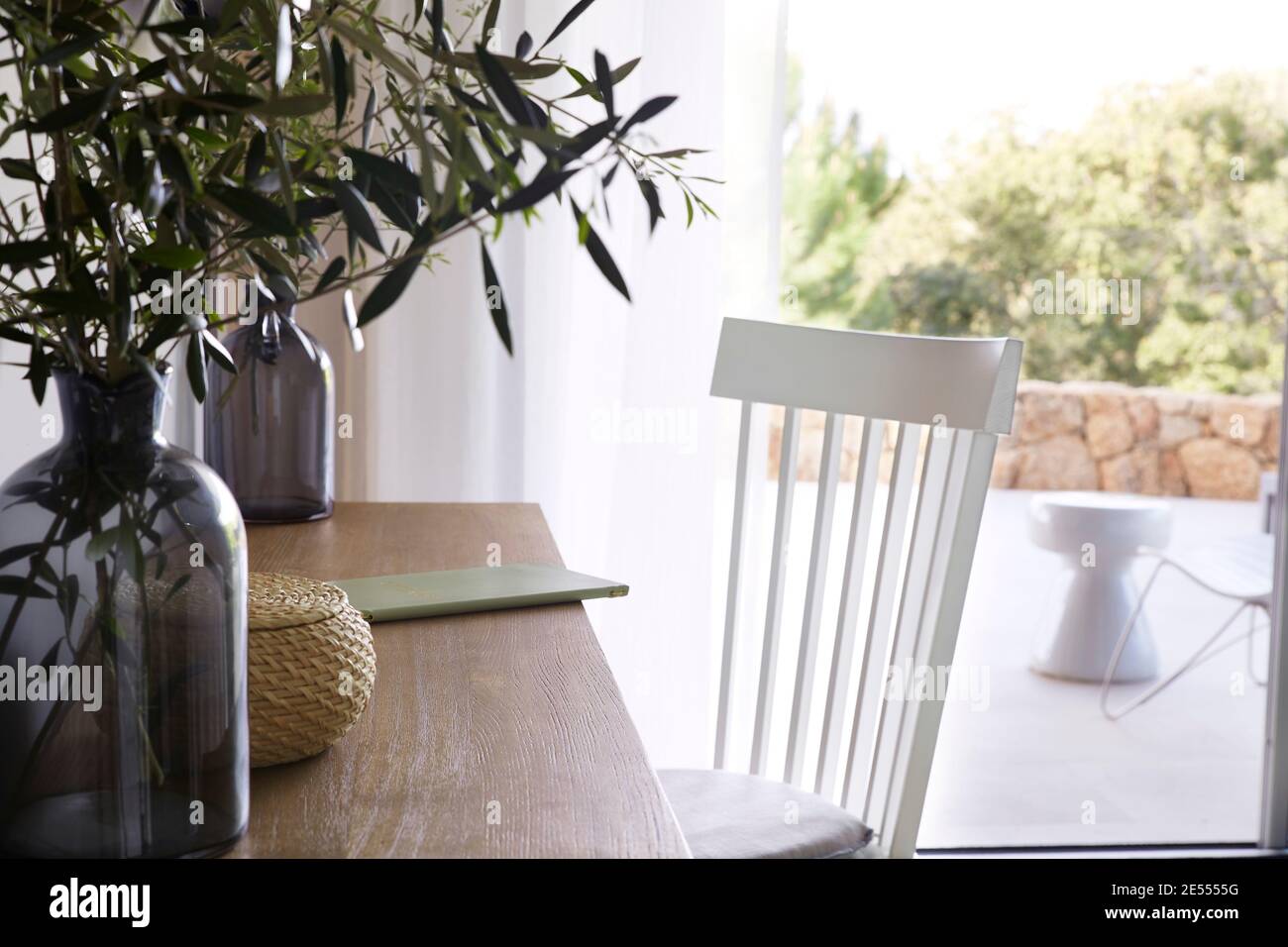 Interior with desk, chair and open window Stock Photo - Alamy