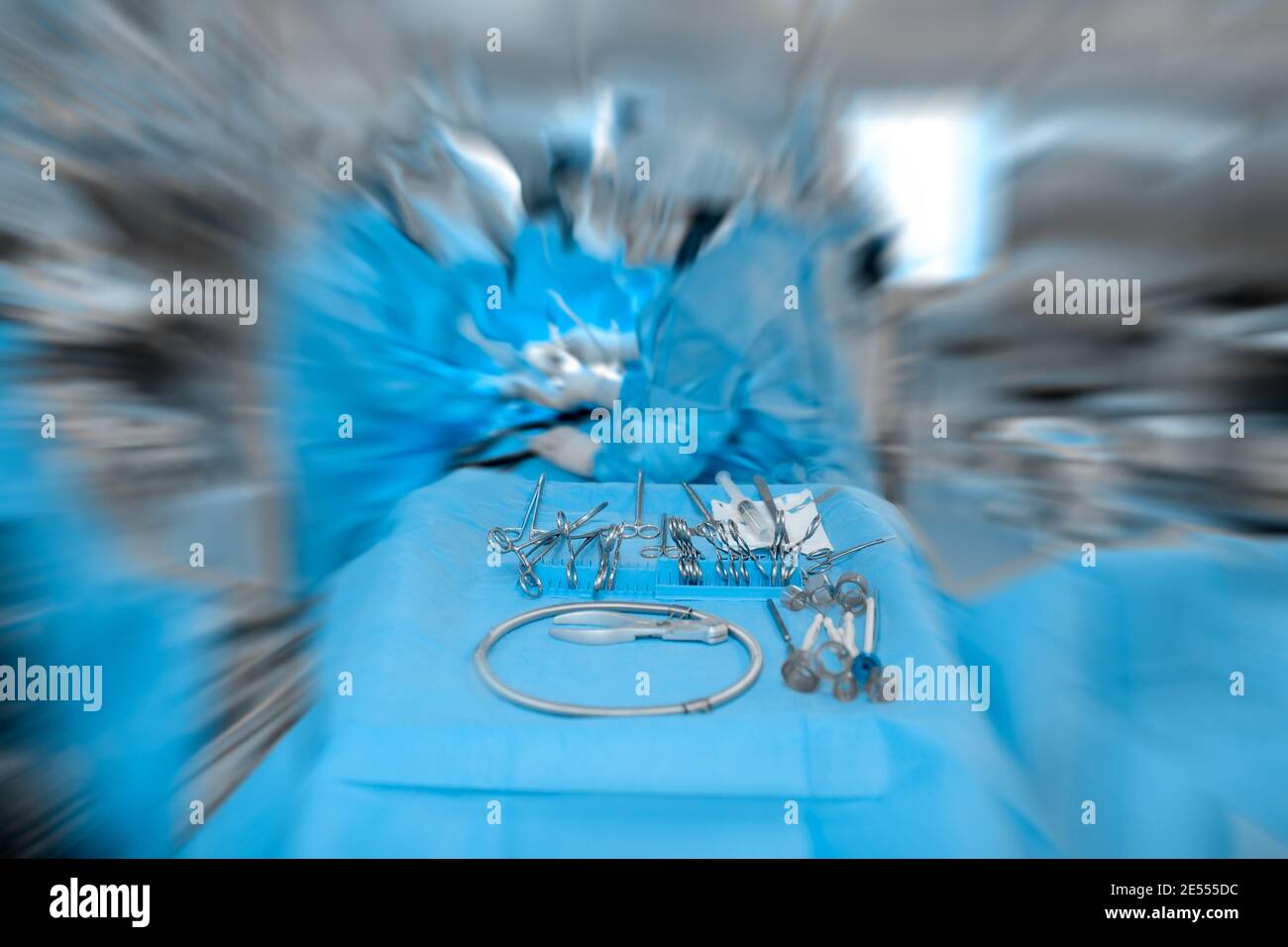 Surgical tools in the operating room with blurred silhouettes of ...