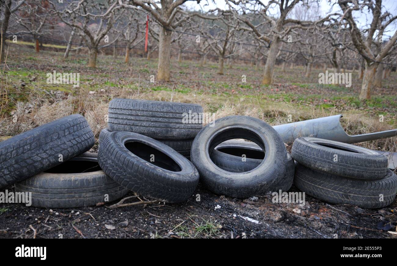 Pile of used tires in nature Stock Photo - Alamy