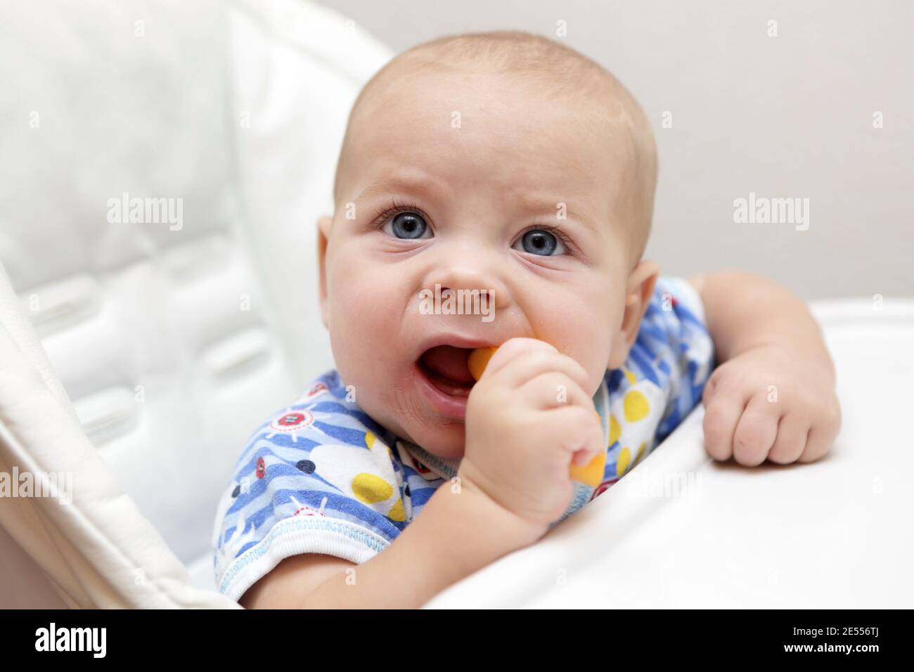 Cute baby eating pumpkin hi-res stock photography and images - Alamy