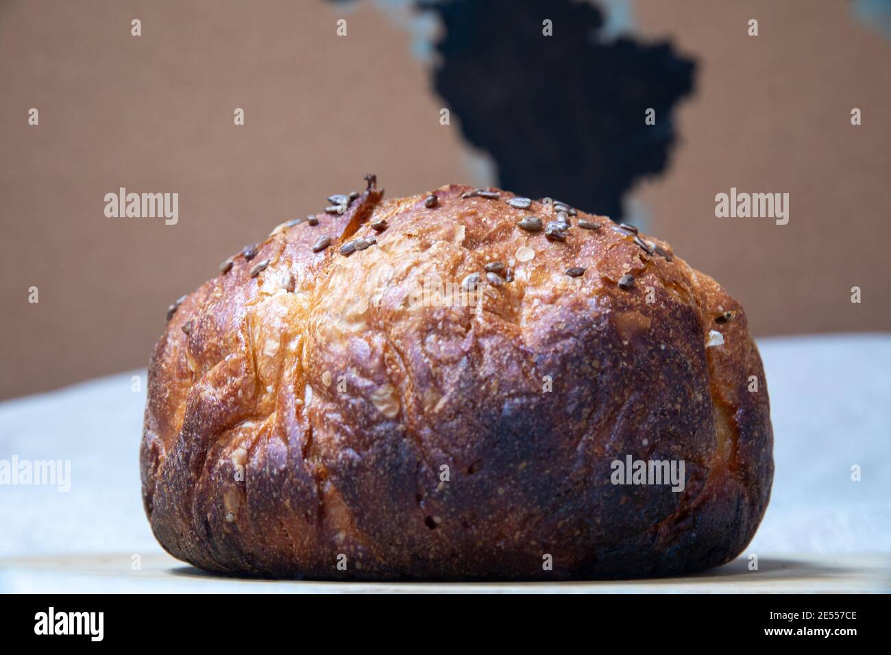 Freshly homemade baked bread on wooden trencher Stock Photo - Alamy