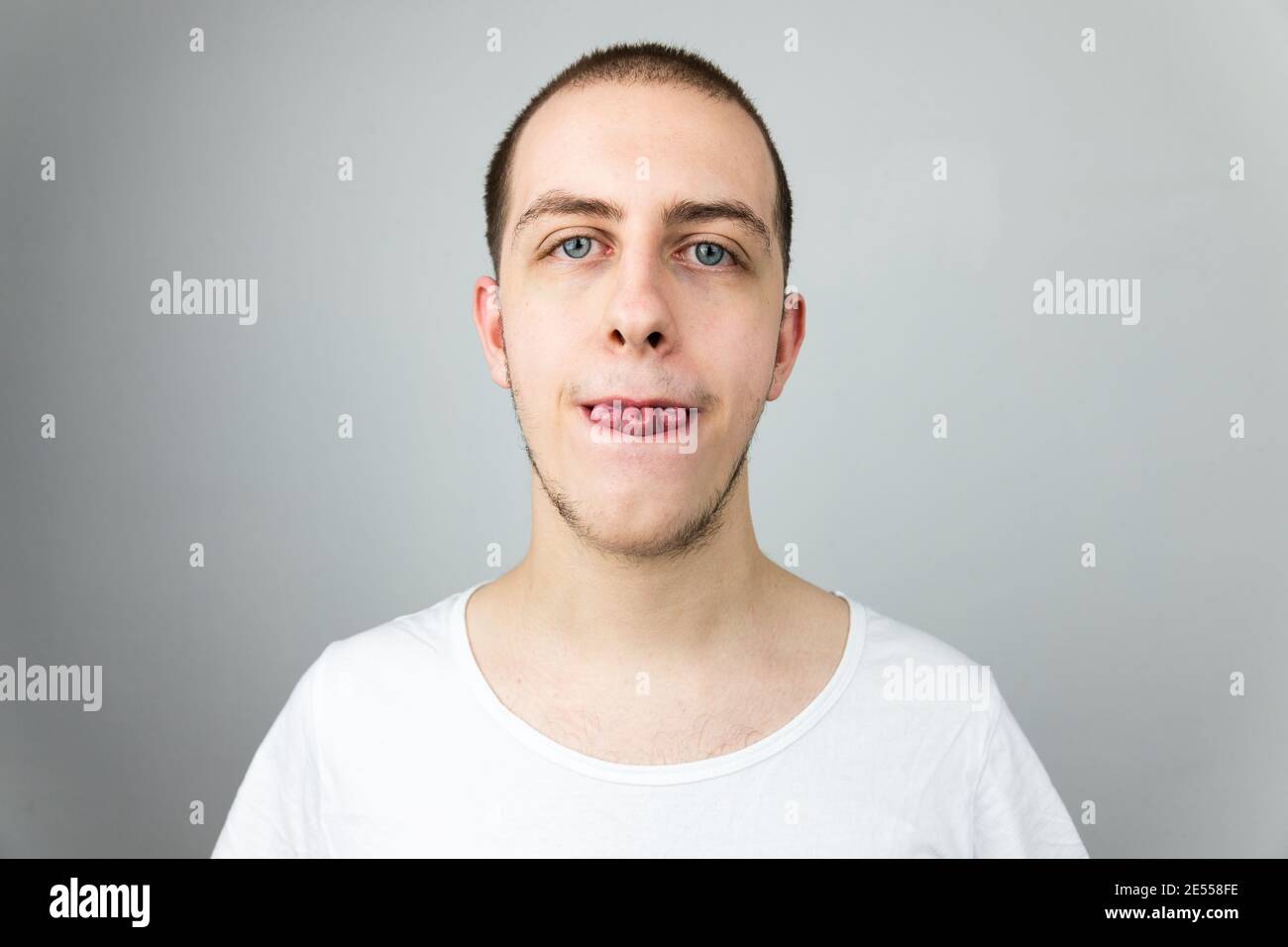 Close up of a young man, folding his tongue in a rare tri fold, clover ...