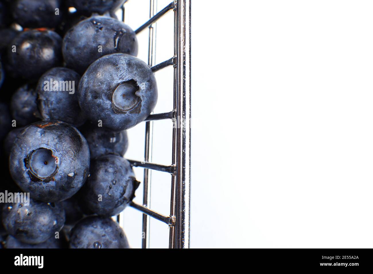 Top view of a fresh blueberries in a metal shopping box isolated on a ...