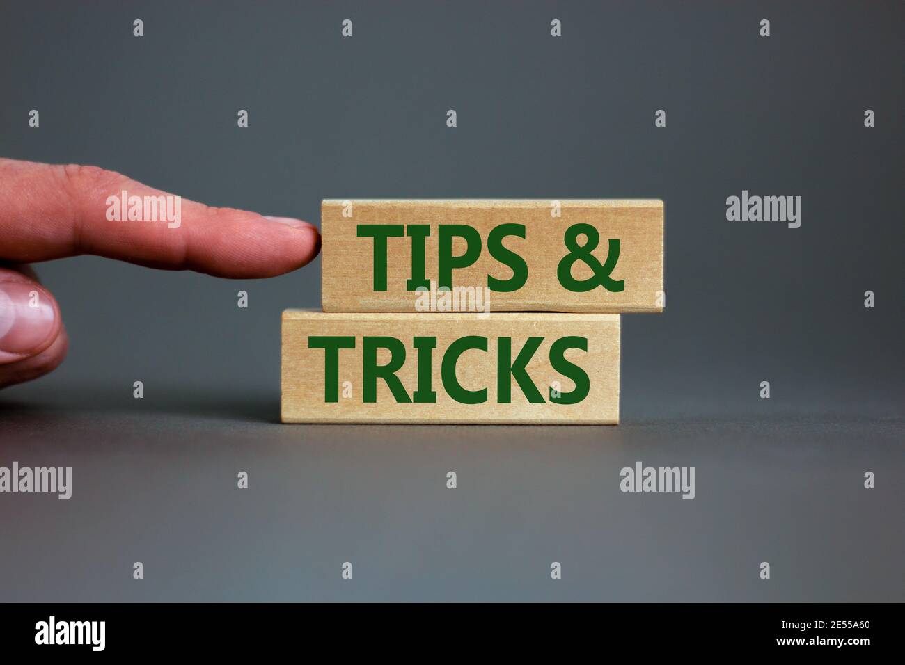 Tips and tricks symbol. Wooden blocks with words 'Tips and tricks ...