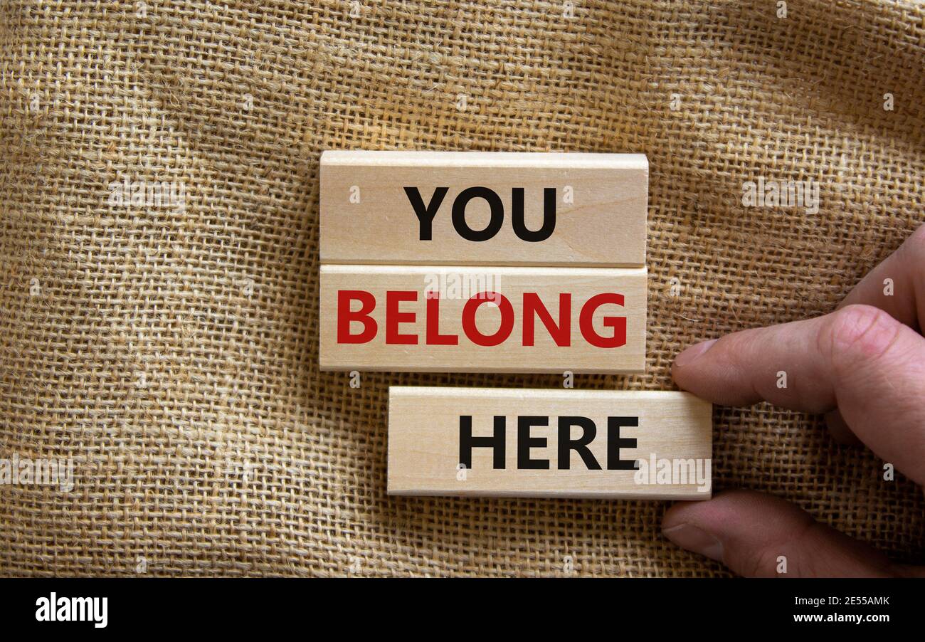 You belong here symbol. Wooden blocks with words 'You belong here' on ...