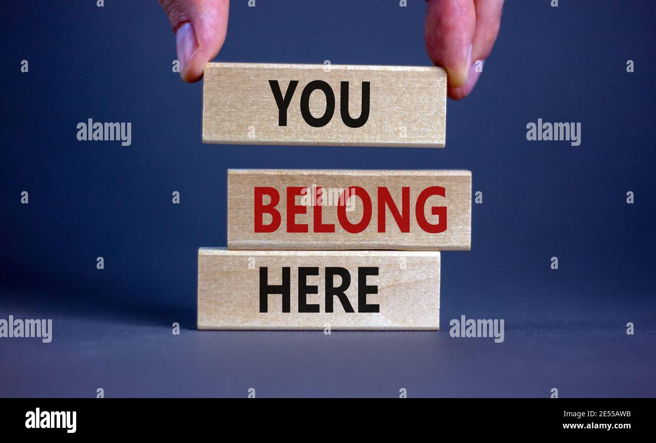 You belong here symbol. Wooden blocks with words 'You belong here' on ...