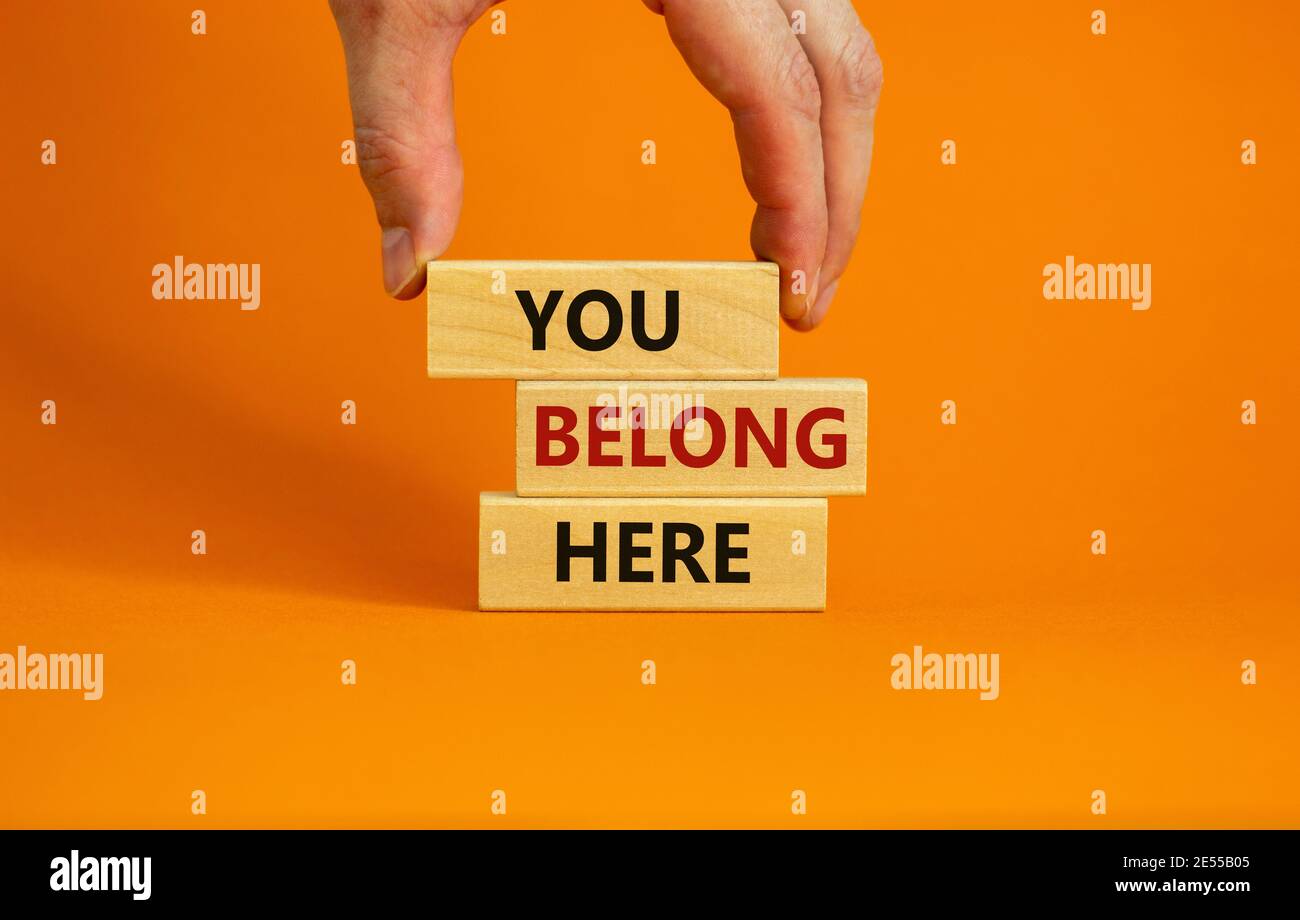 You belong here symbol. Wooden blocks with words 'You belong here' on ...