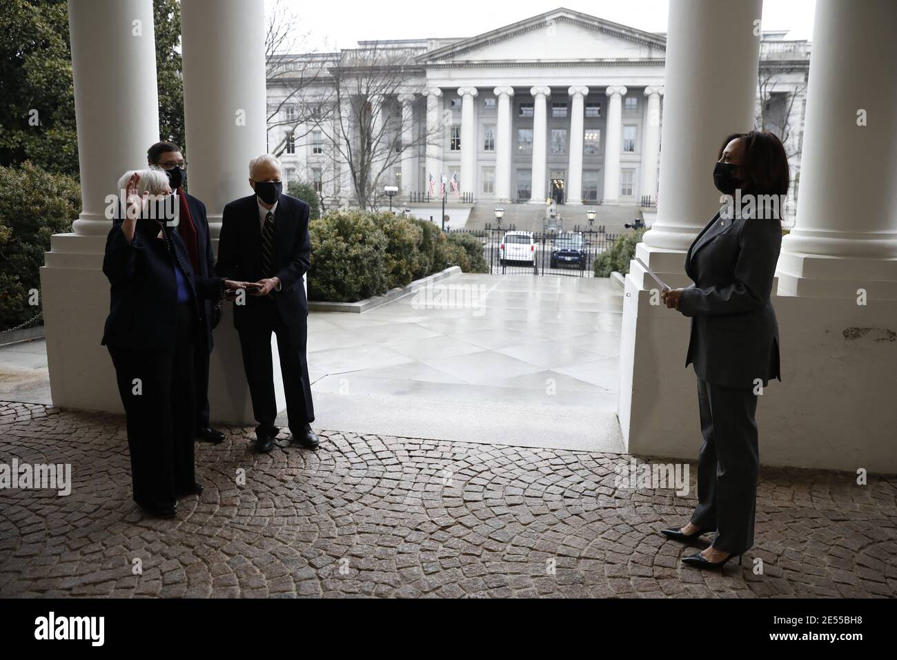 U.S. Treasury Secretary Janet Yellen (L) is sworn in next to her ...