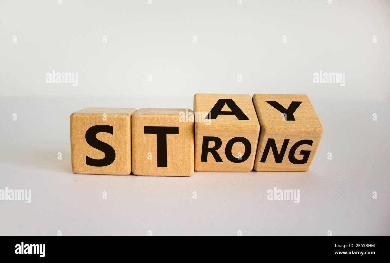 Stay strong symbol. Turned wooden cubes with words 'stay strong ...
