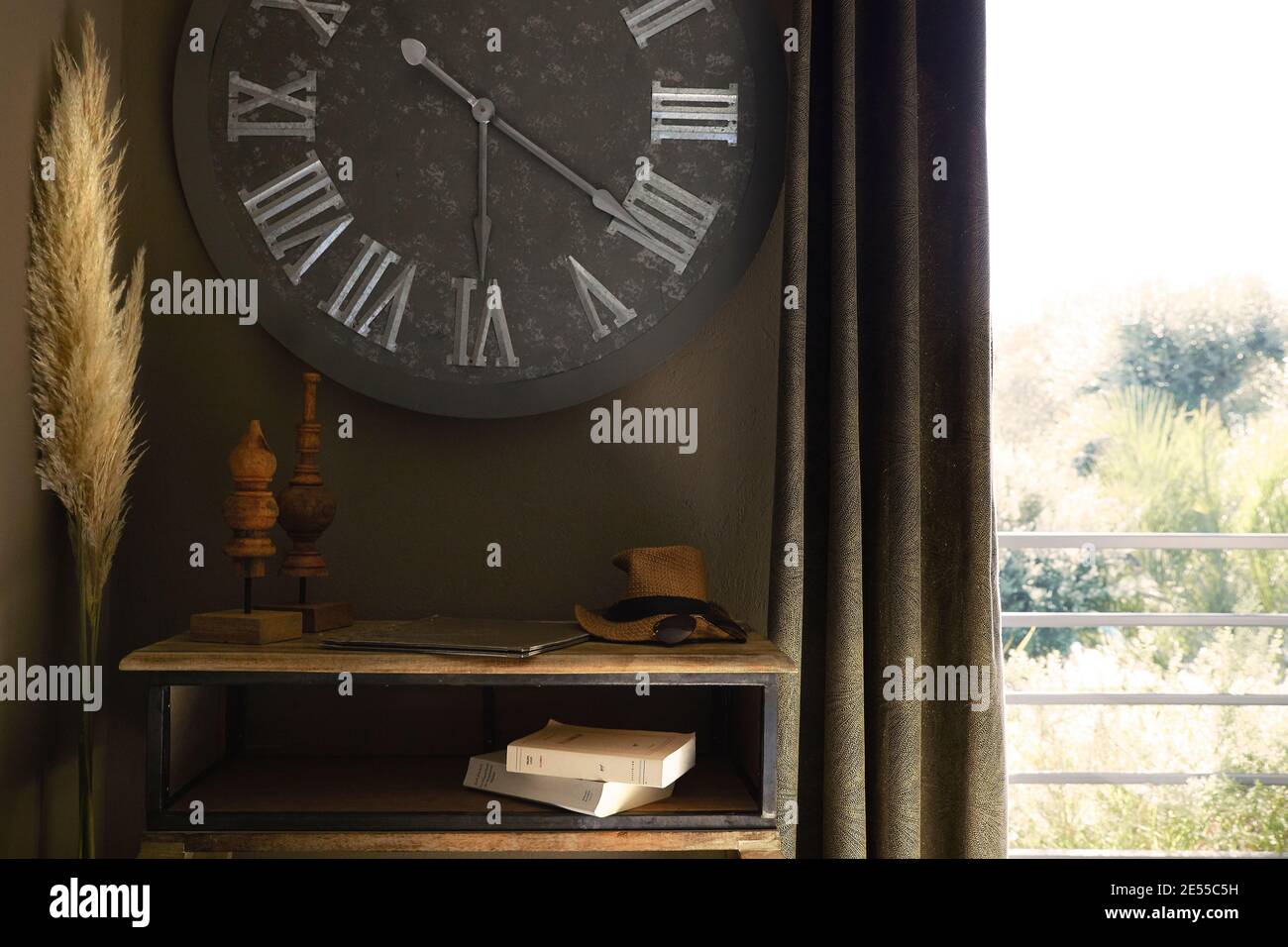 Interior photography room, clock, desk, books, hat Stock Photo - Alamy