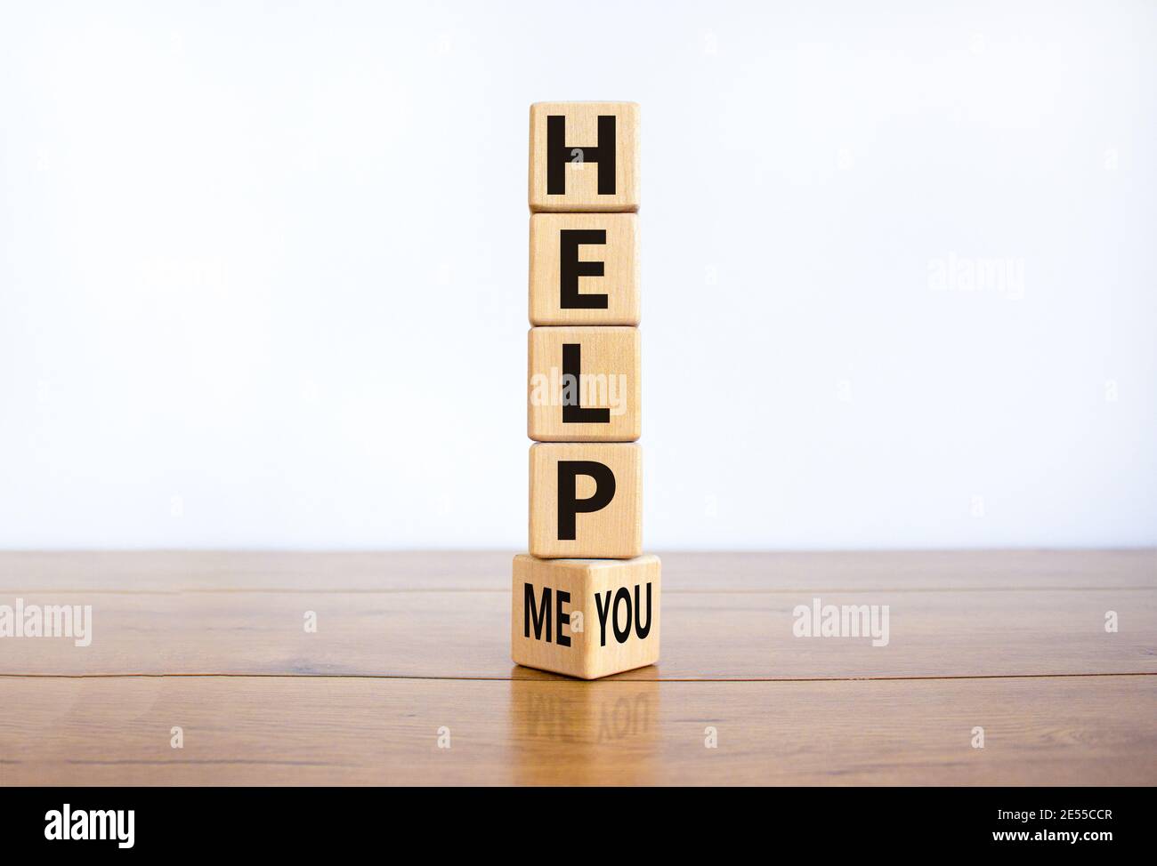 Help you or me symbol. Turned wooden cubes and changed words help me to ...