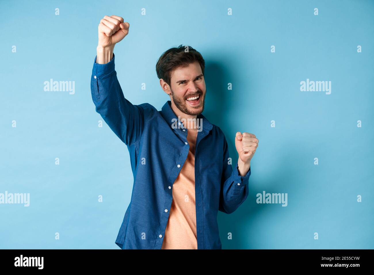 Lucky man celebrating victory, cheering and shouting yes with joy ...