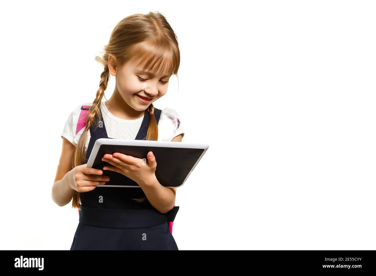 little girl using tablet computer. Isolated on white background Stock ...
