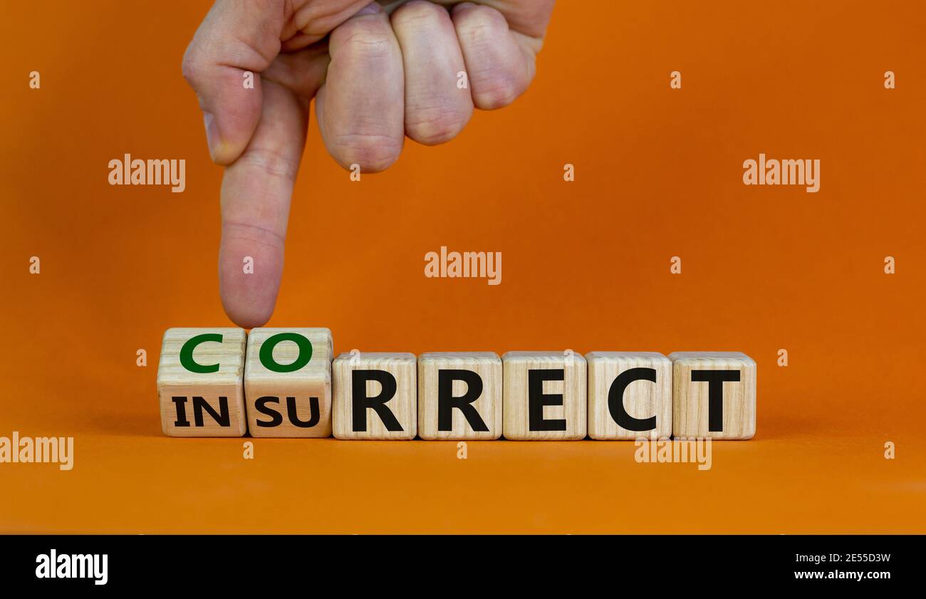 Correct vs insurrect symbol. Businessman hand turns wooden cubes and ...