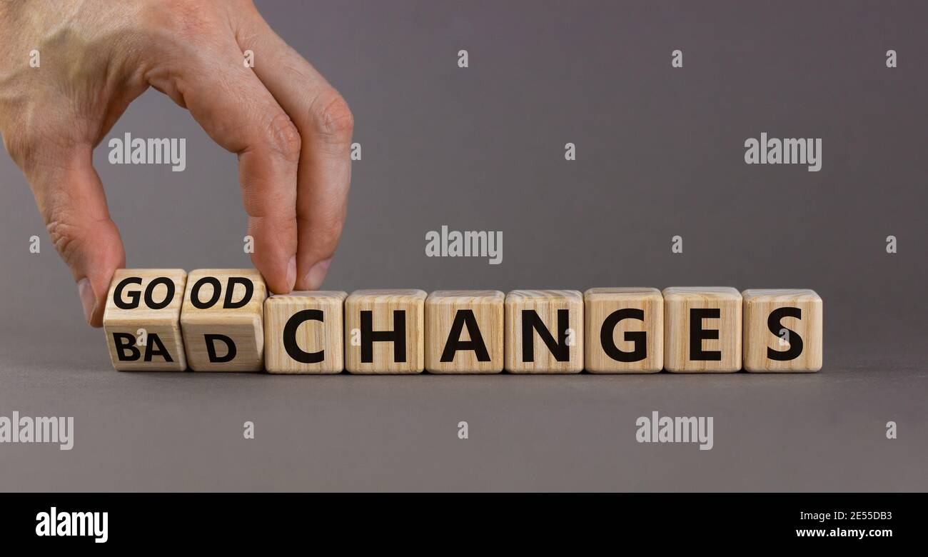 Bad or good changes symbol. Businessman turns wooden cubes and changes ...