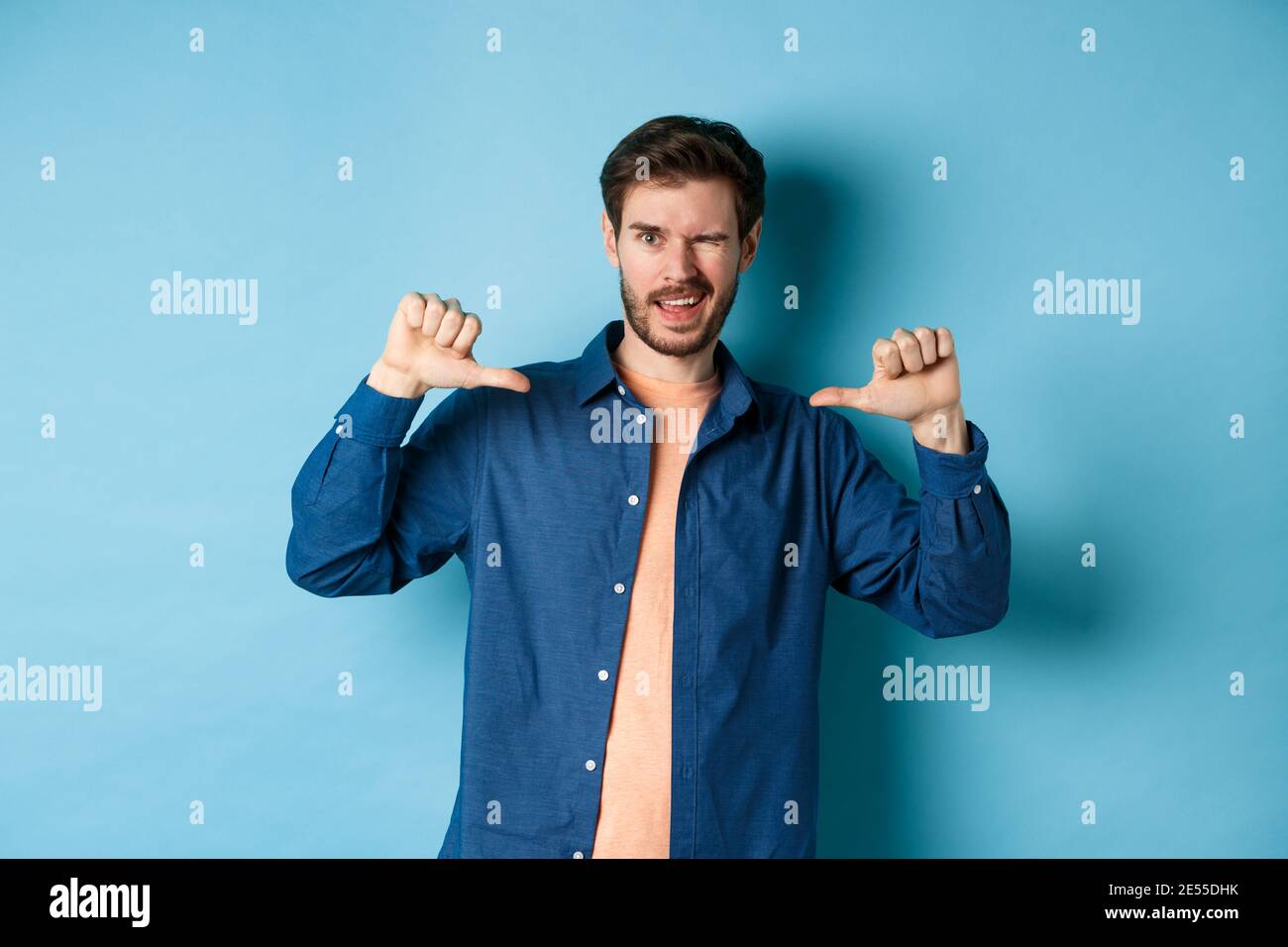 Mature winking man pointing hi-res stock photography and images - Alamy