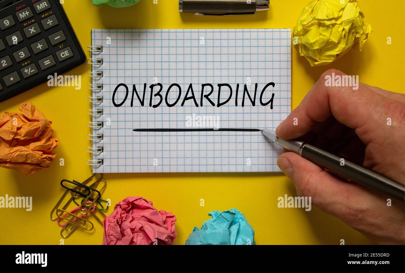 Onboarding symbol. Businessman writing word 'onboarding' on white note ...