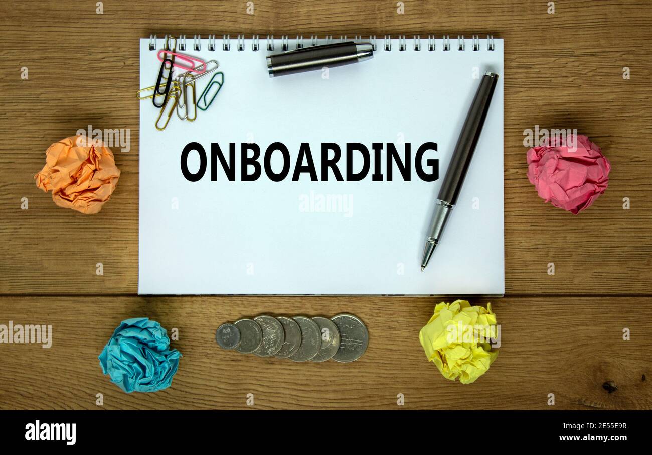 Onboarding symbol. White note with a word onboarding on beautiful ...