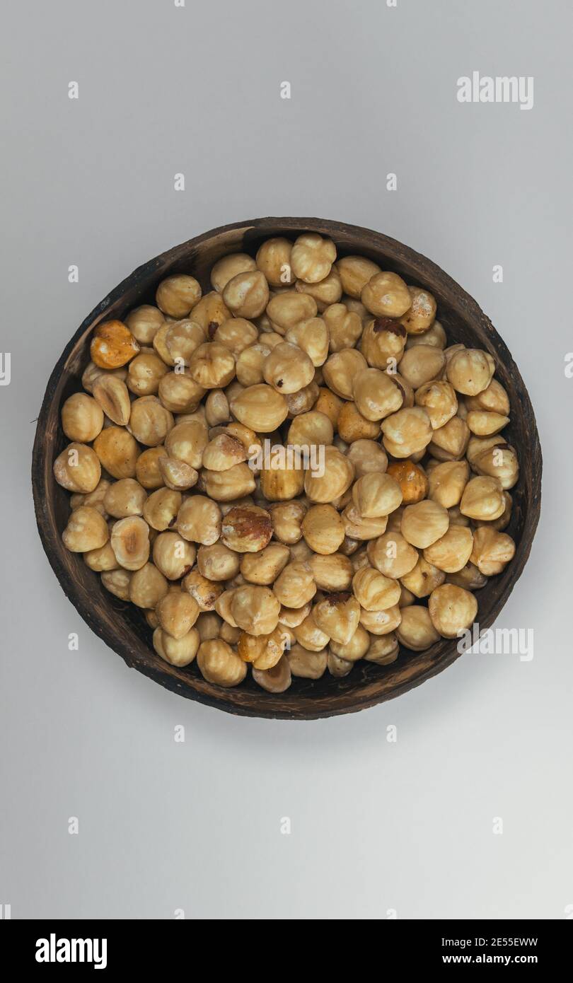 Filled and half hazelnuts on white background. Isolated with banana ...