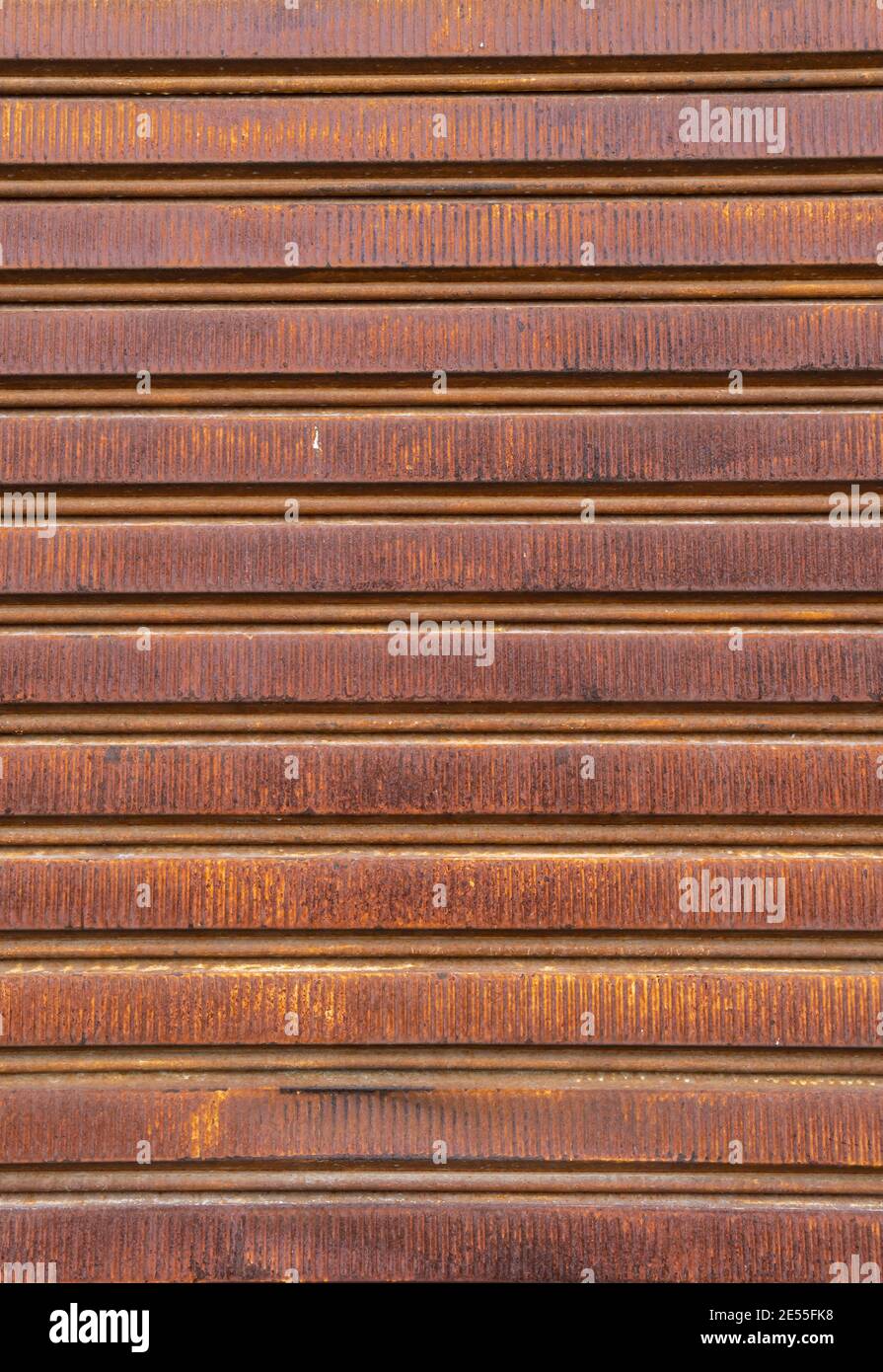 Close-up of a rusted and deteriorated metal fence. Background image ...