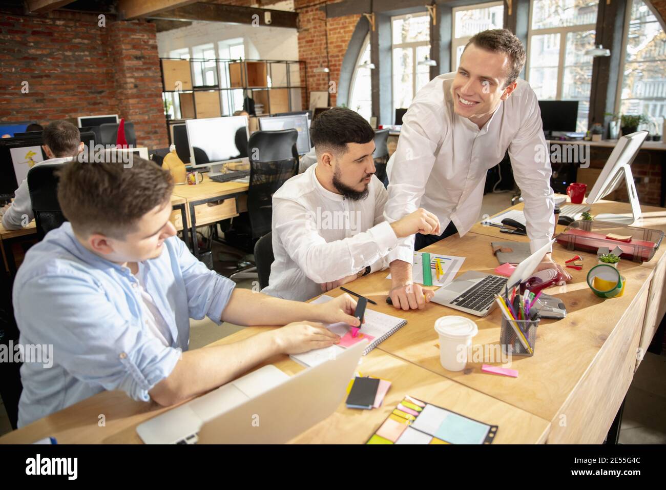 Young creative team using desktop hi-res stock photography and images ...