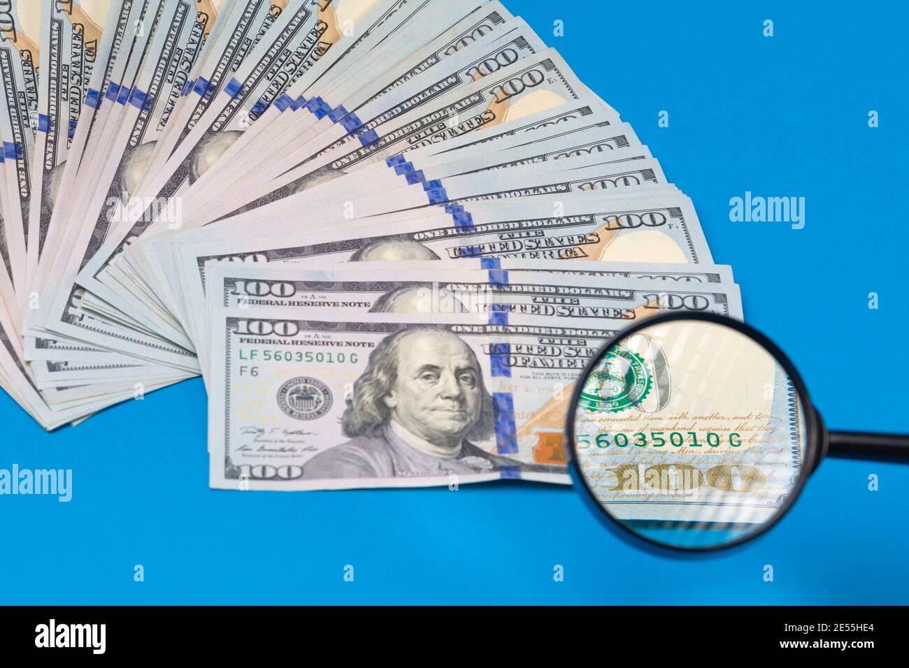 Magnifier and dollar bill hi-res stock photography and images - Alamy