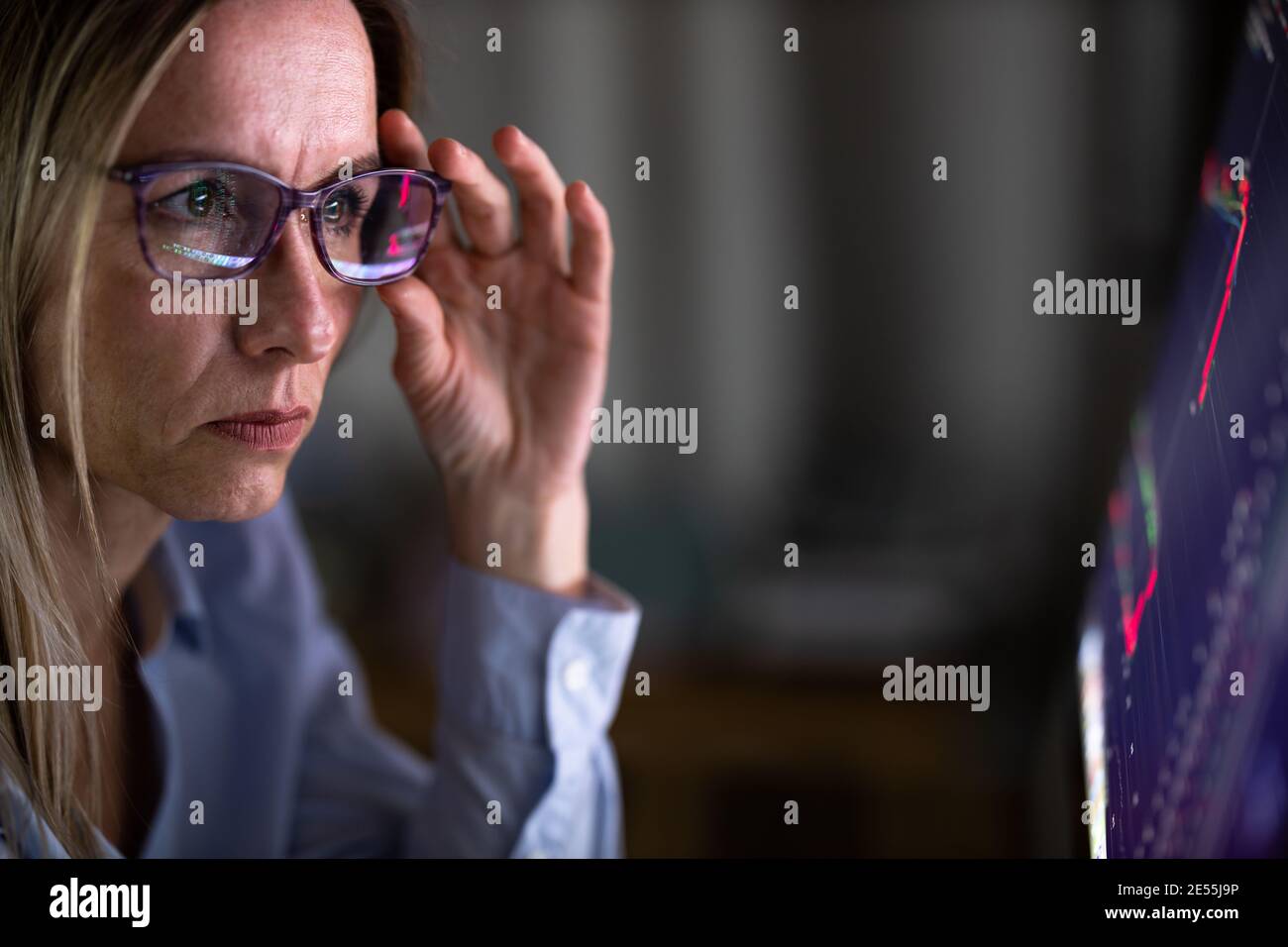 Happy stylish mid-aged woman remote working from home, staring at the ...