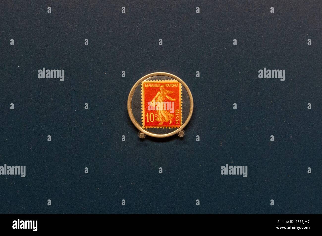 A French postage stamp encased in aluminium (to be used as a coin) c ...