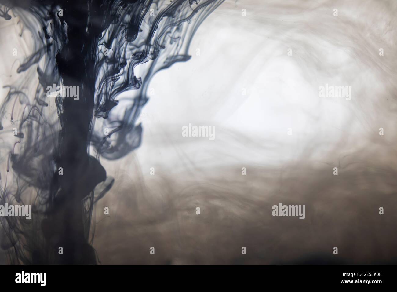 Cloud of silky blue ink under water isolated on white Stock Photo - Alamy