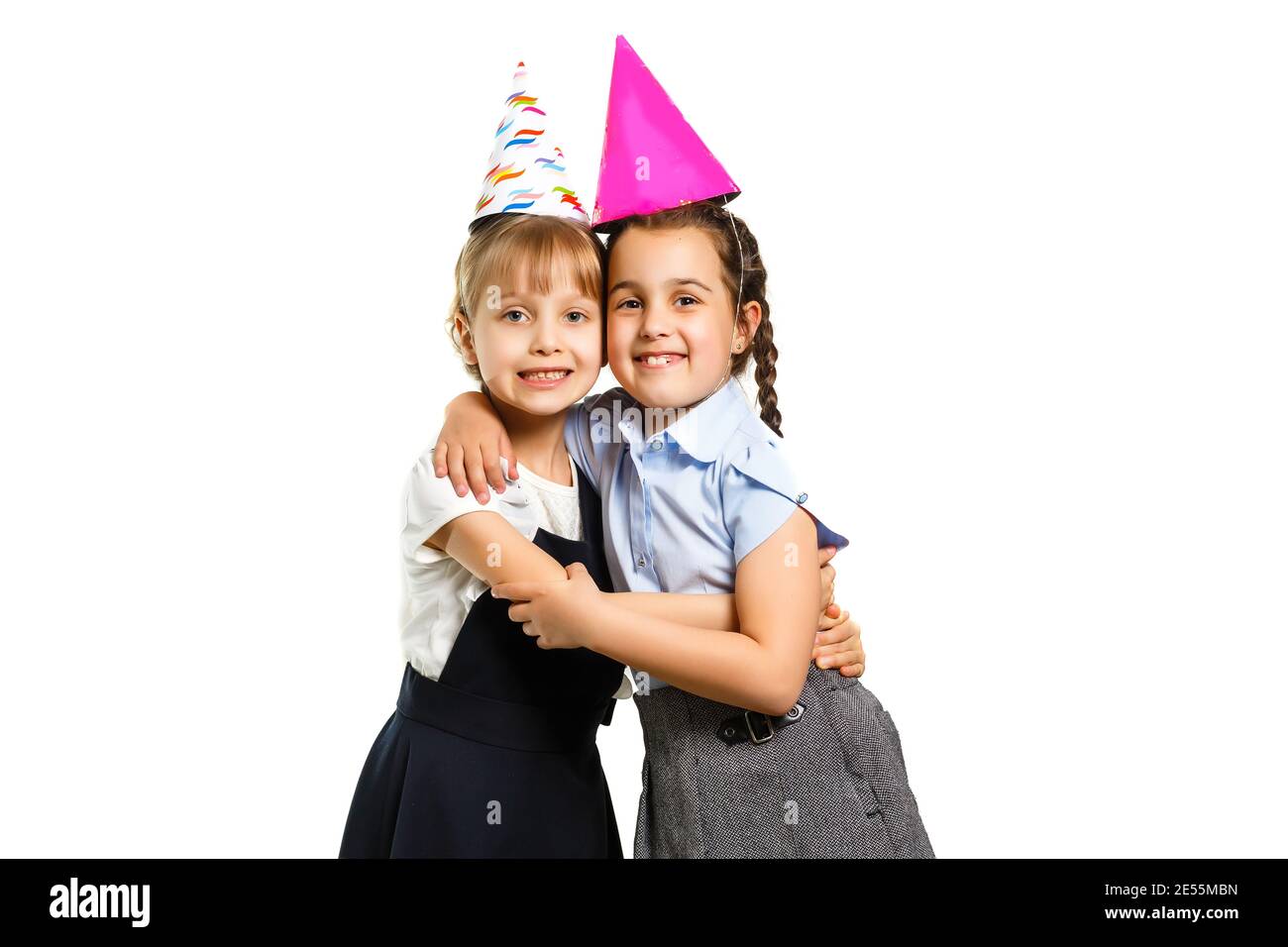 Two birthday girls in shirt blue school uniform dresses hat isolated on ...