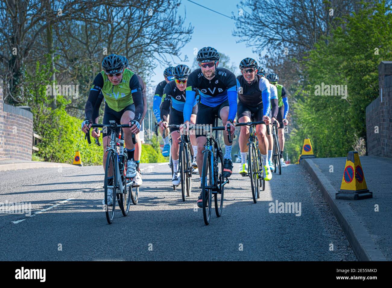 Members of midlands based OVB cycling club pass over a railway bridge ...