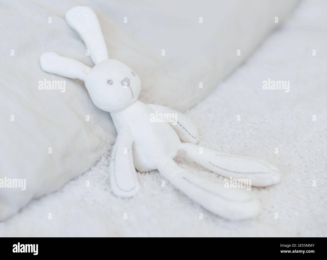 Easter funny white stuffed rabbit toy on the white bed zero west ...