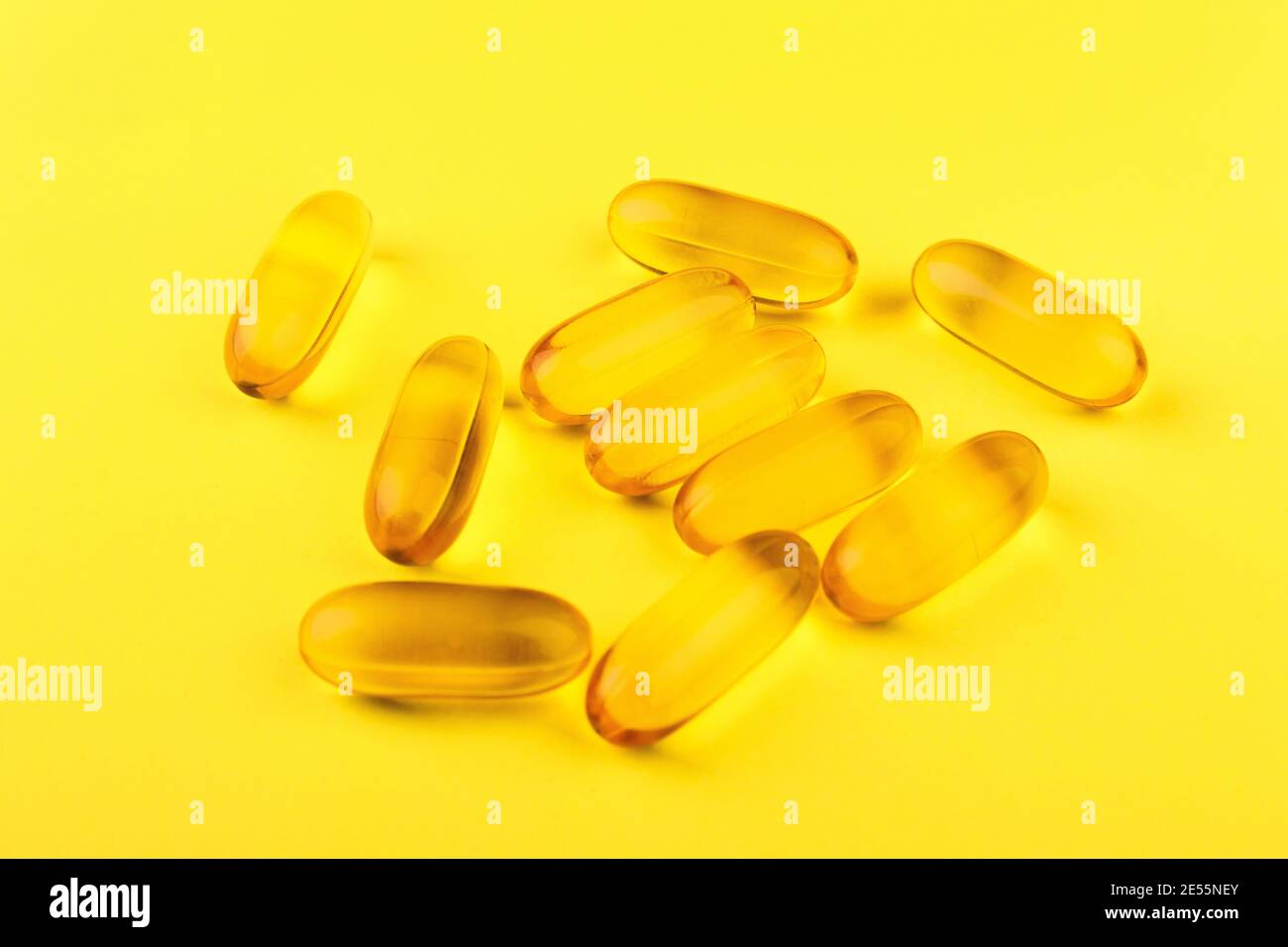 Yellow gold medical capsule hi-res stock photography and images - Alamy