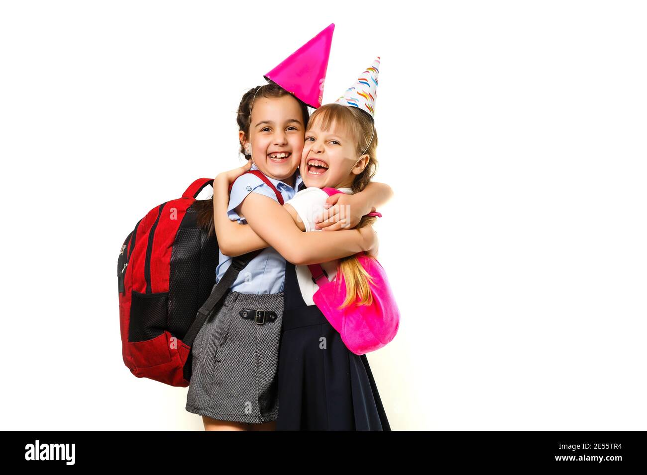 Two birthday girls in shirt blue school uniform dresses hat isolated on ...