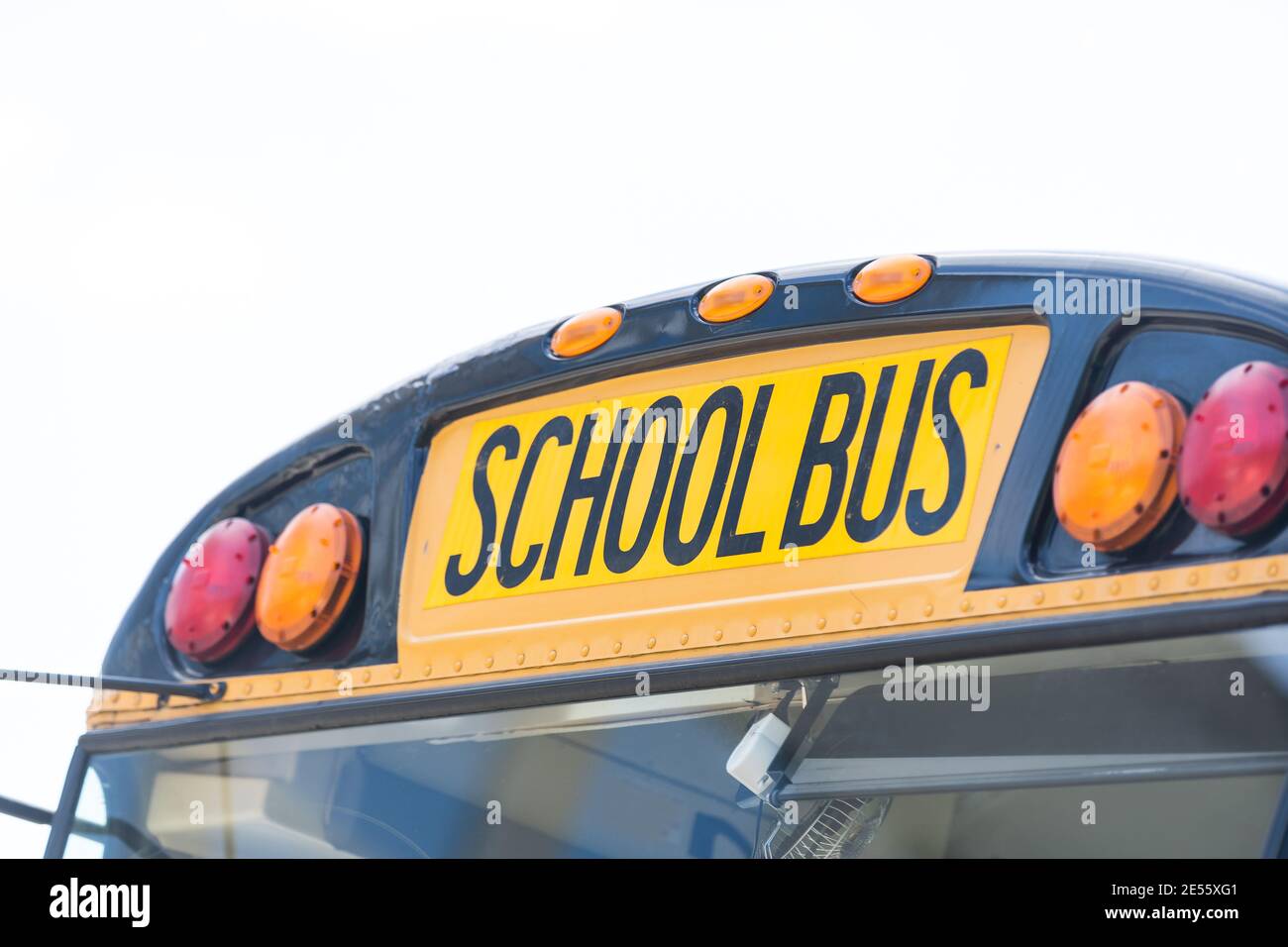 Yellow school bus on the street Stock Photo - Alamy