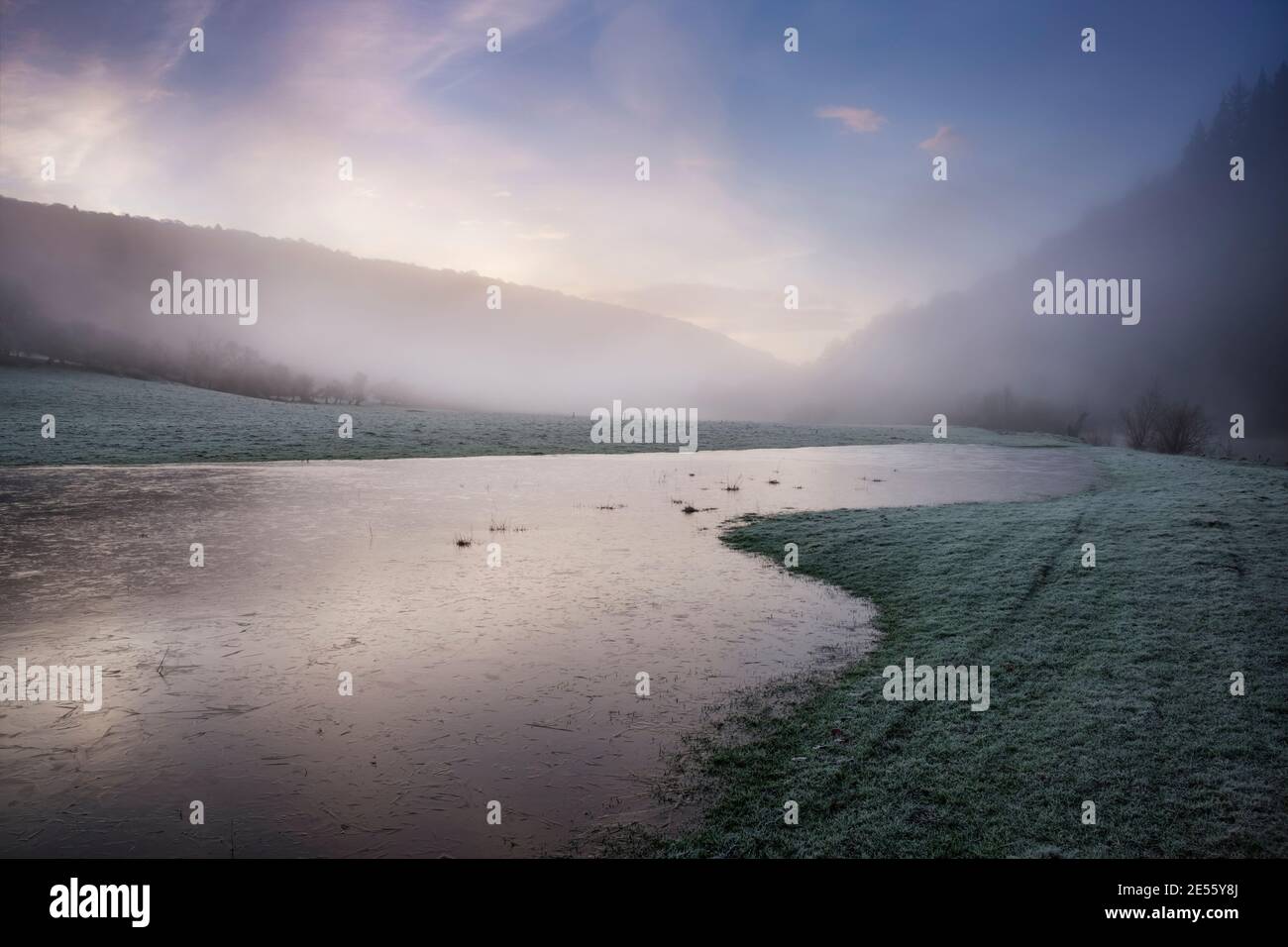 Large body of frozen flood water adjacent to the river Wye at Llandogo ...