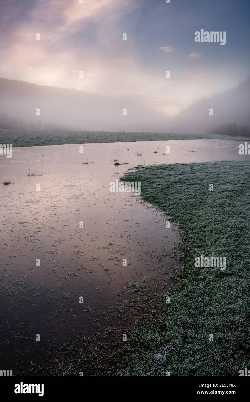 Large body of frozen flood water adjacent to the river Wye at Llandogo ...