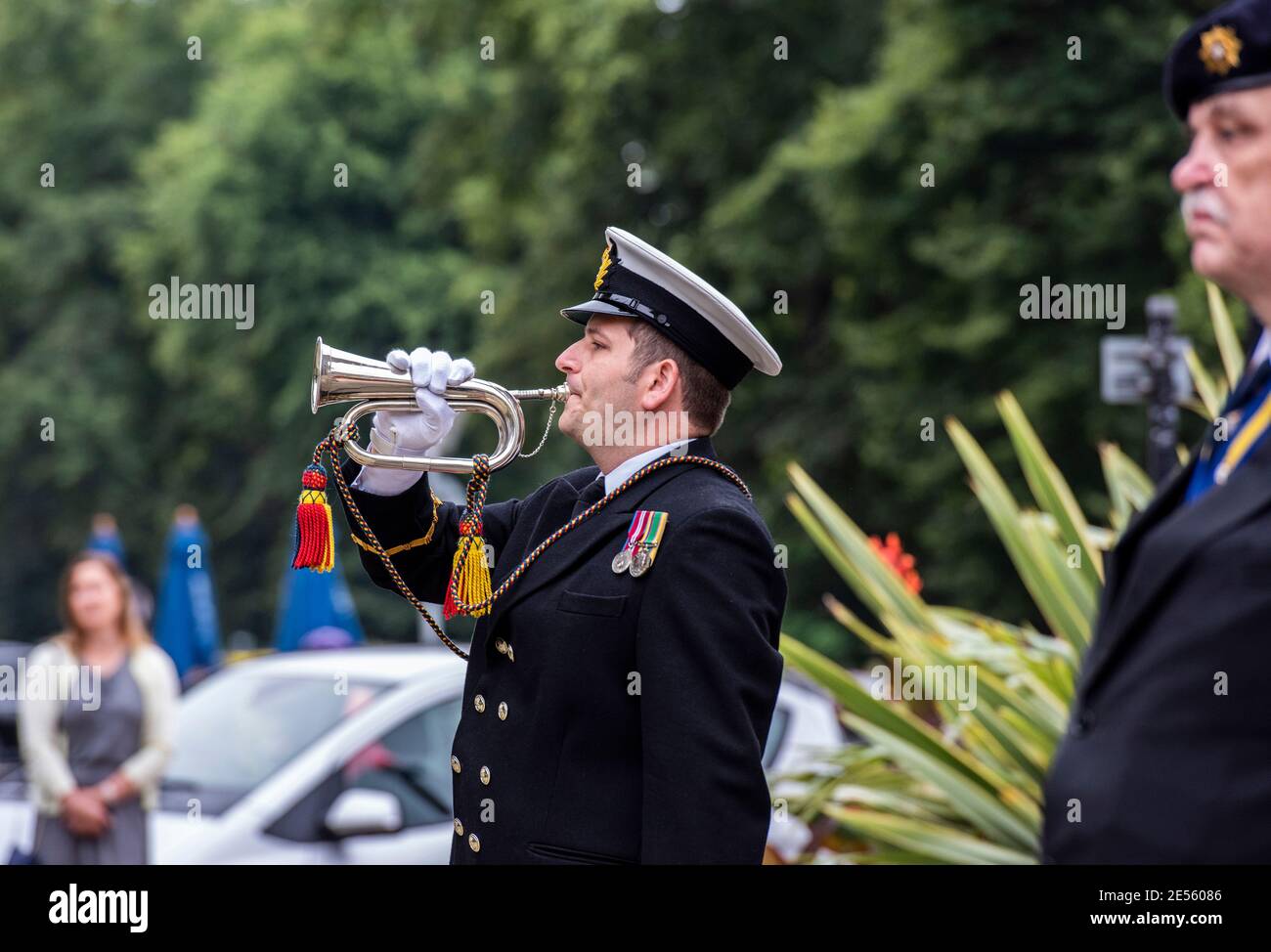 A soldier blows his trumpet to mark the beginning of 2 minutes of ...