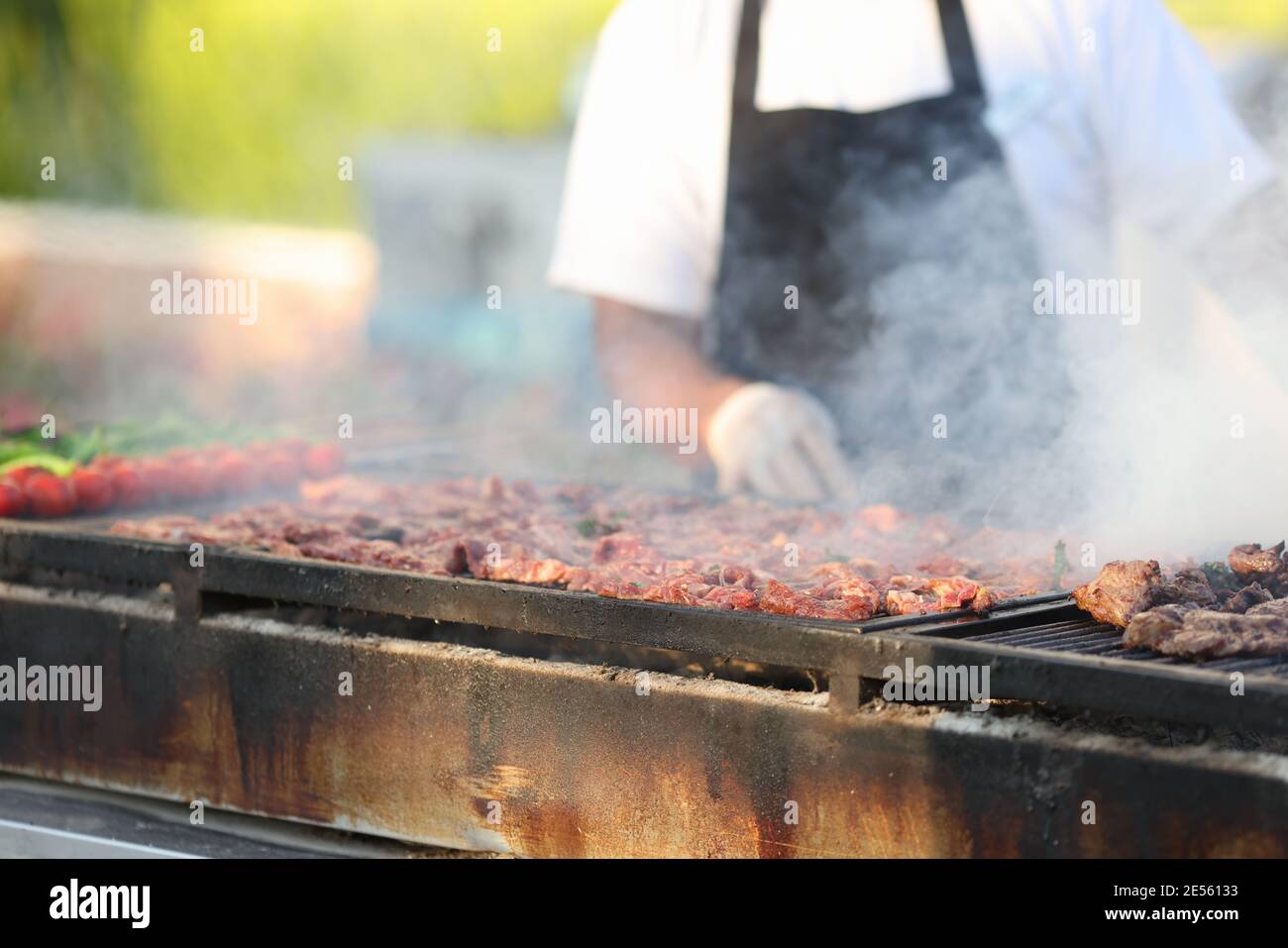 Cooking meat on wire rack and charcoal Stock Photo - Alamy