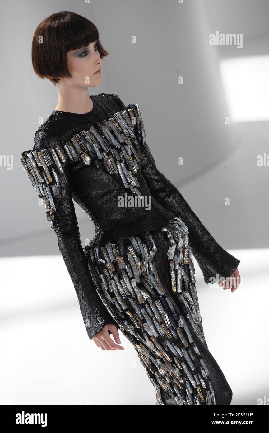 A model displays a creation by designer Karl Lagerfeld for Chanel fall ...
