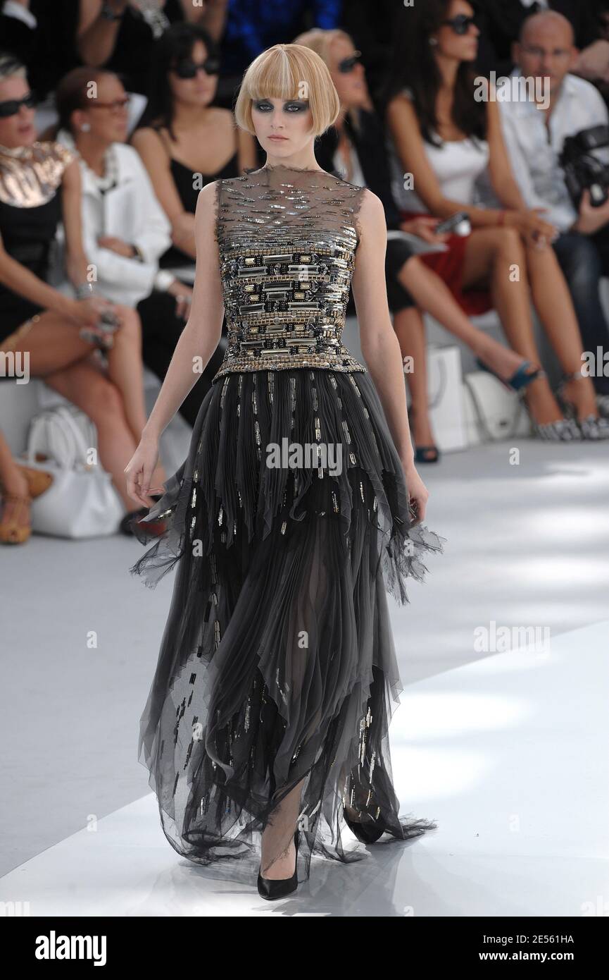 A model displays a creation by designer Karl Lagerfeld for Chanel fall ...