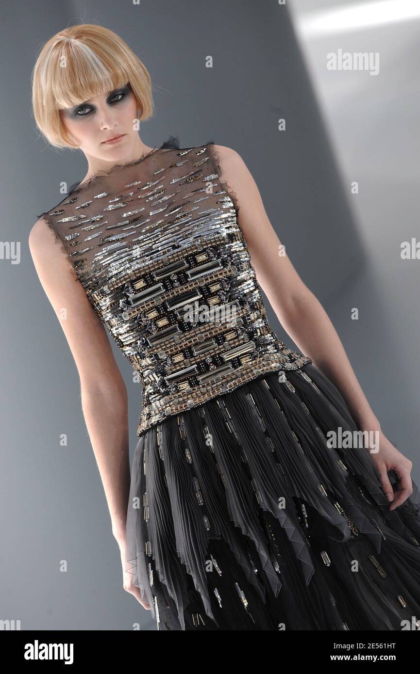 A model displays a creation by designer Karl Lagerfeld for Chanel fall ...