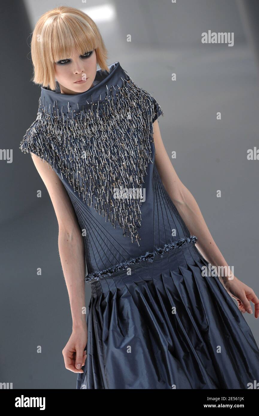 A model displays a creation by designer Karl Lagerfeld for Chanel fall ...