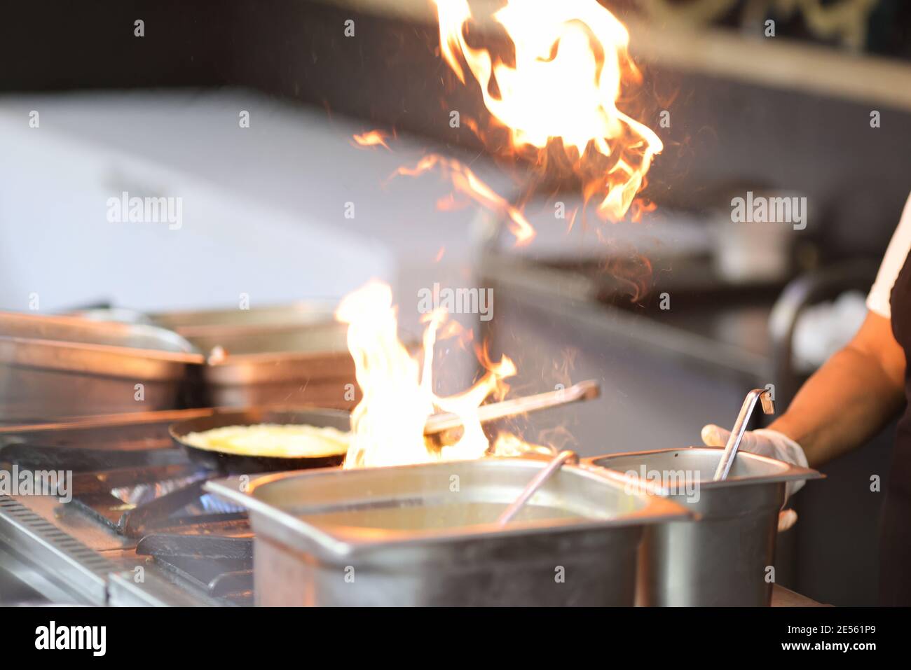 Burning hand on pan hi-res stock photography and images - Alamy