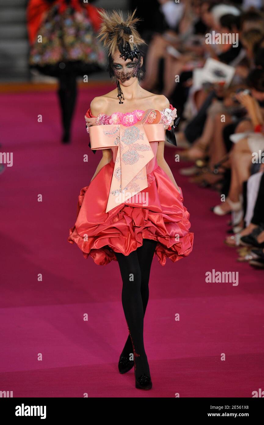 A model presents a creation by French designer Christian Lacroix as ...