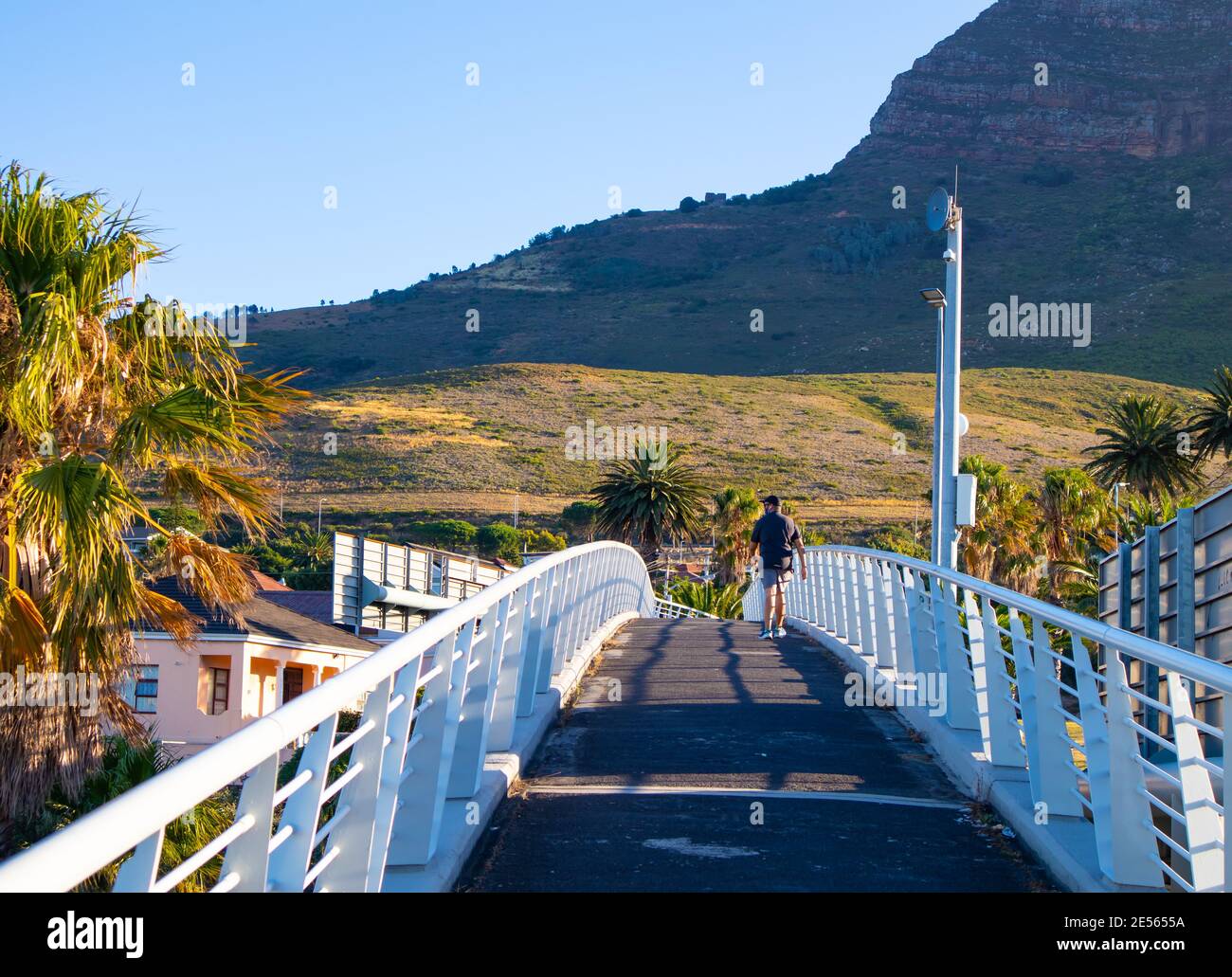 Woman walking along main road hi-res stock photography and images - Alamy