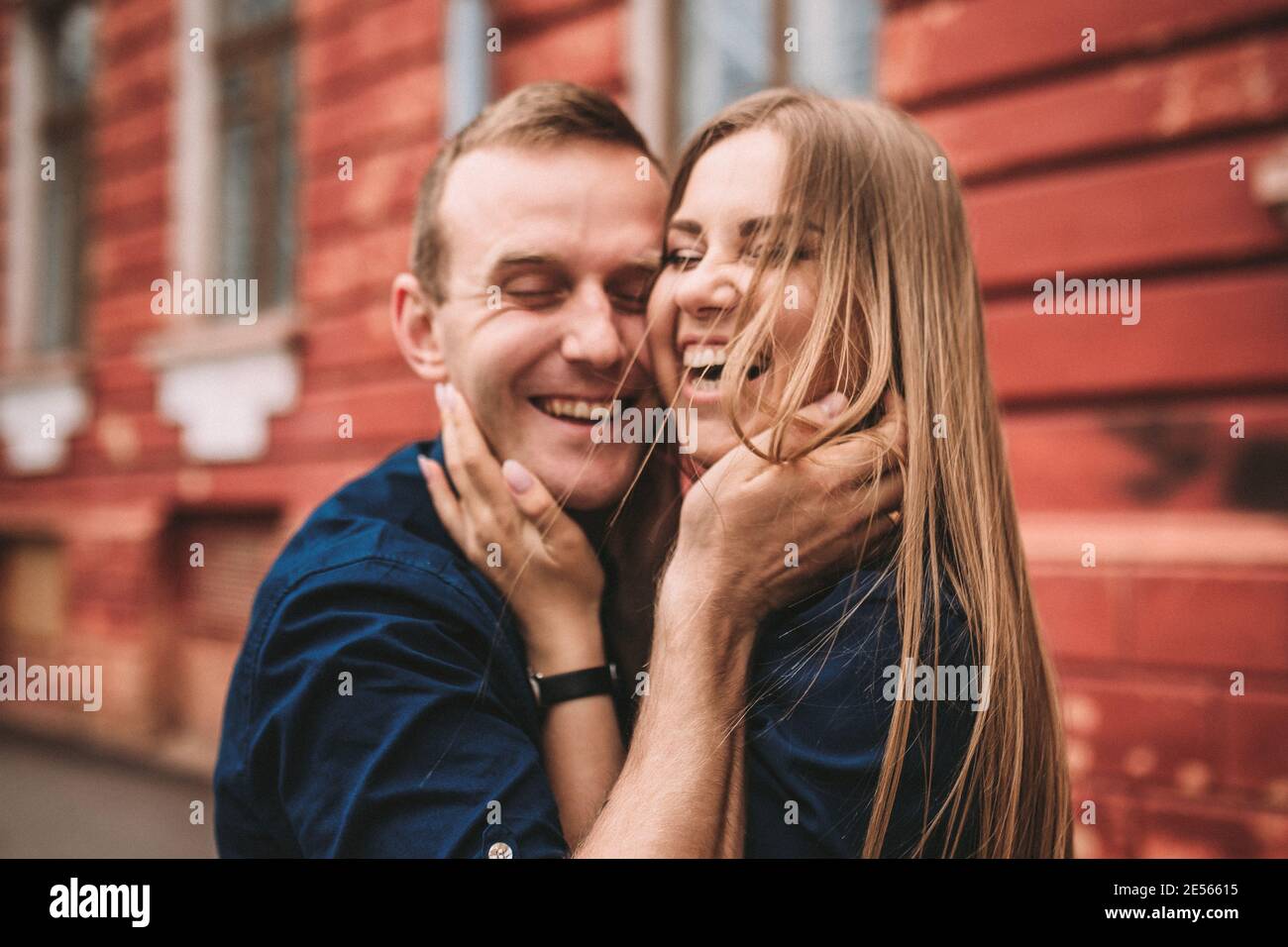 Happy couple hugging and smiling. Portrait of a guy and a girl with a ...