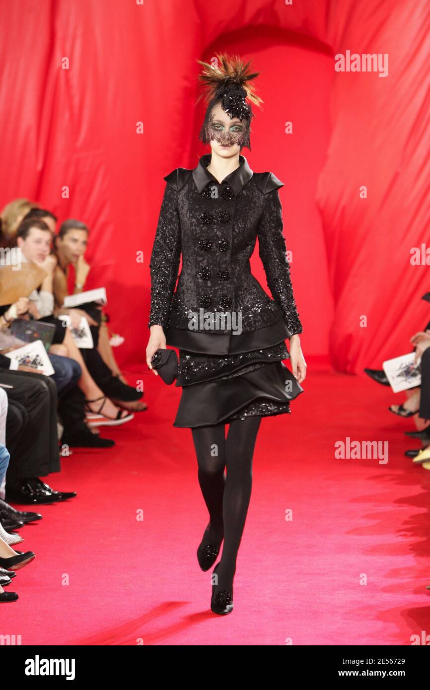 A model presents a creation by French designer Christian Lacroix as ...
