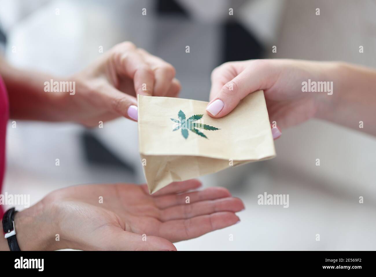 Handing over bag hi-res stock photography and images - Alamy